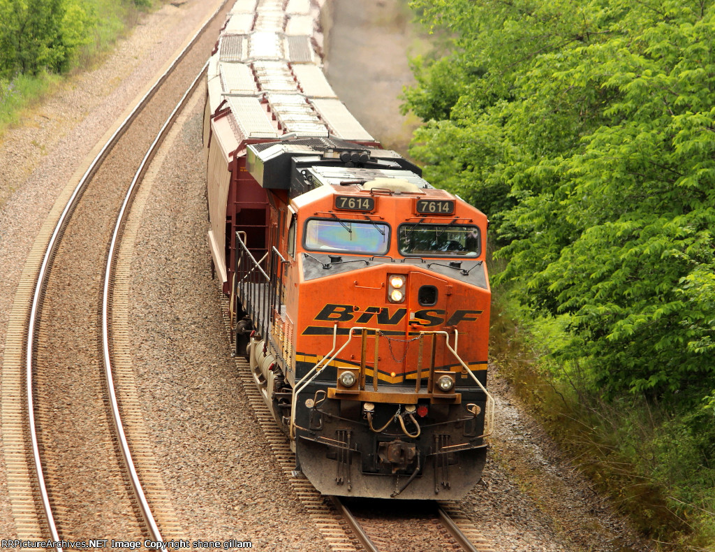 BNSF 7614 works dpu on this wb grain train.